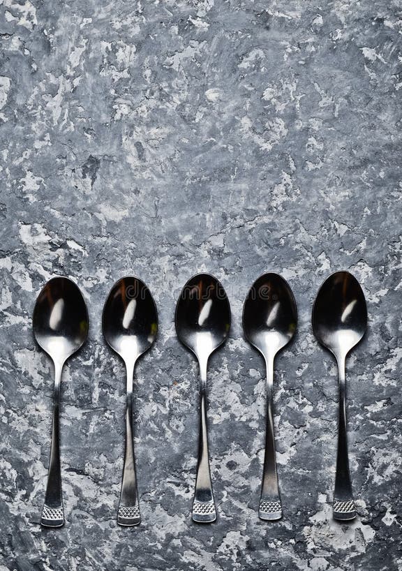 Spoons and on Concrete Background. Stock Image - Image of background ...