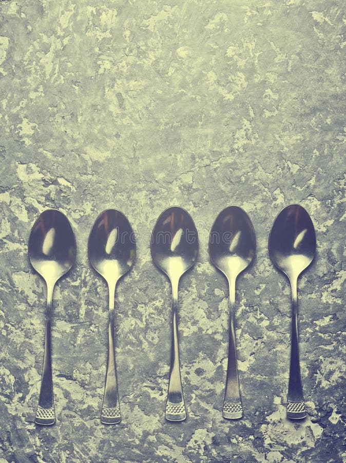 Spoons on Concrete Background. Stock Image - Image of steel, spoons ...