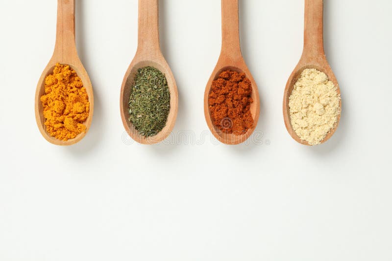 Spoons with Different Powder Spices on White Background Stock Photo ...
