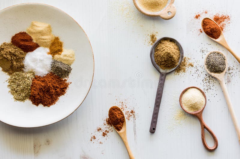 Spoons with Messy Piles of Spices and a Piles on a Plate with Copy ...