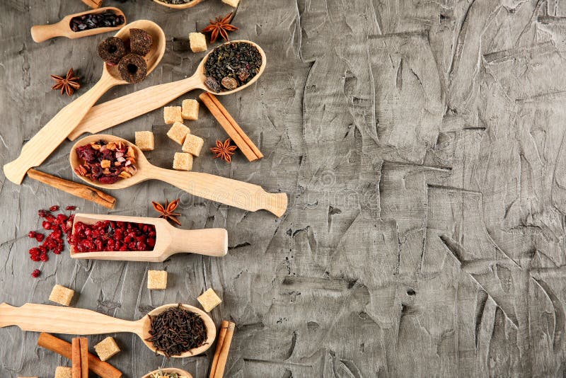 Spoons and Scoop with Different Types of Tea on Table Stock Photo ...