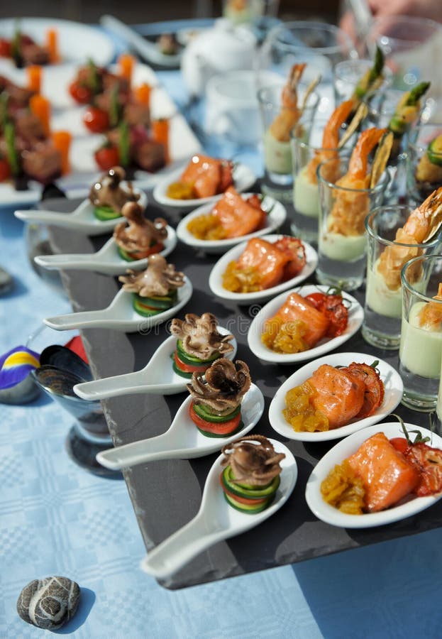 Spoons with seafood snacks stock image. Image of vertical - 25127901