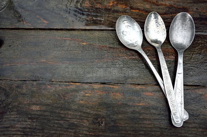 Spoons on the wooden table stock image. Image of shiny - 32058679