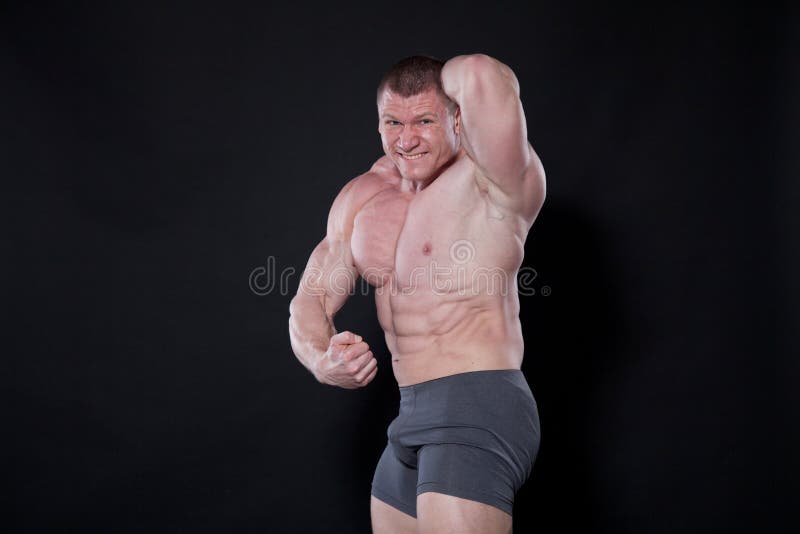 Sport the Athlete Bodybuilder Shows Off His Muscles Stock Image - Image ...