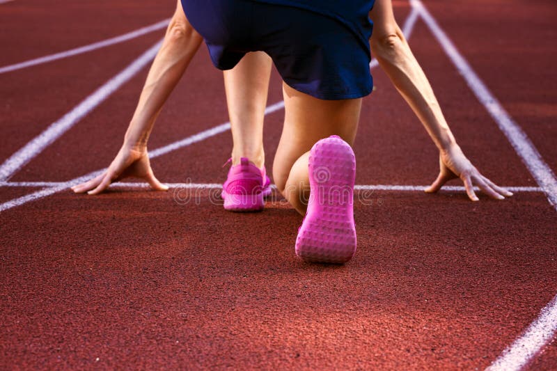 Sport Backgrounds. Sprinter Starting on the Running Track. Dramatic ...