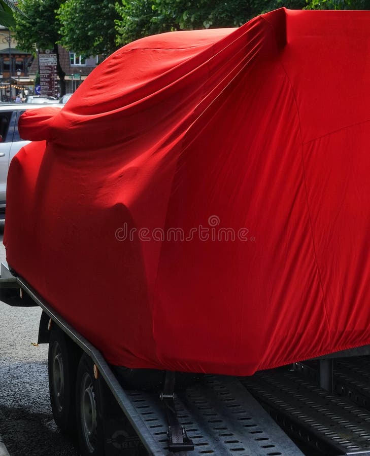 Sport Car Under a Red Sheet on the Streets of Sinaia Stock Photo ...