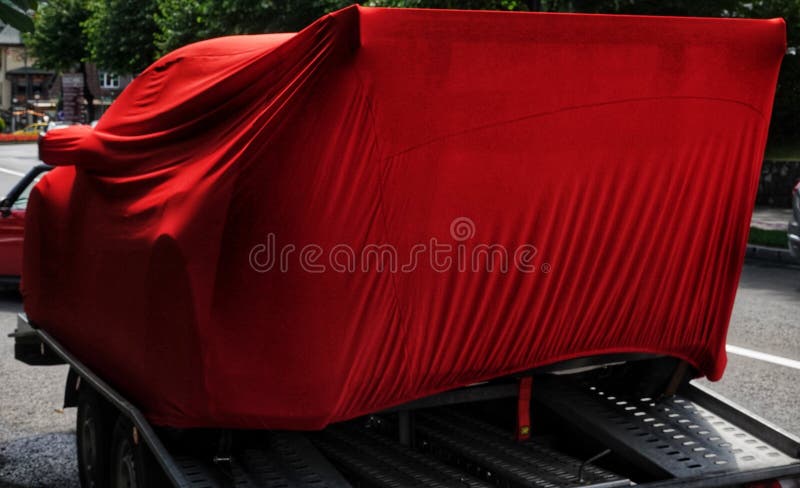 Sport Car Under a Red Sheet on the Streets of Sinaia Stock Image ...