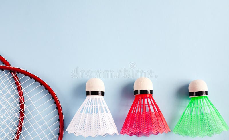 Sport Flat Lay with Three Multi-colored Shuttlecocks and Two Rackets ...