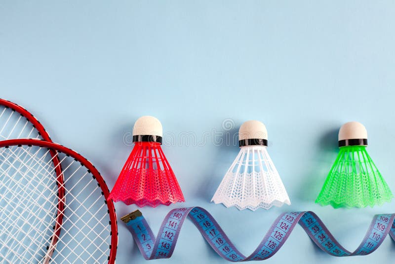 Sport Flat Lay with Three Multi-colored Shuttlecocks, Two Rackets for ...