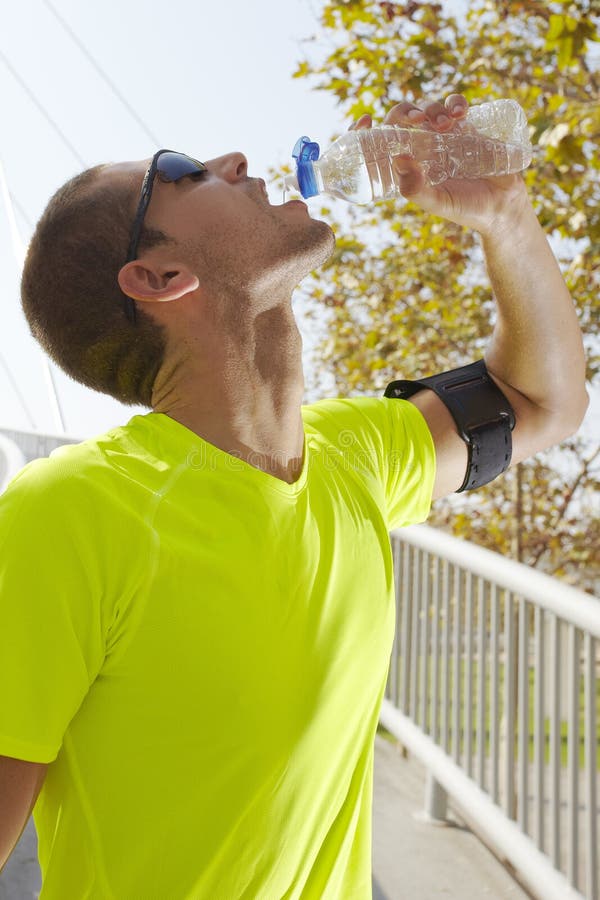 Sport man drinking water stock image. Image of runner - 27313103