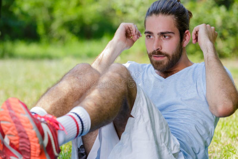 Sport Man Exercise Abs on Grass Park Stock Photo - Image of adult ...