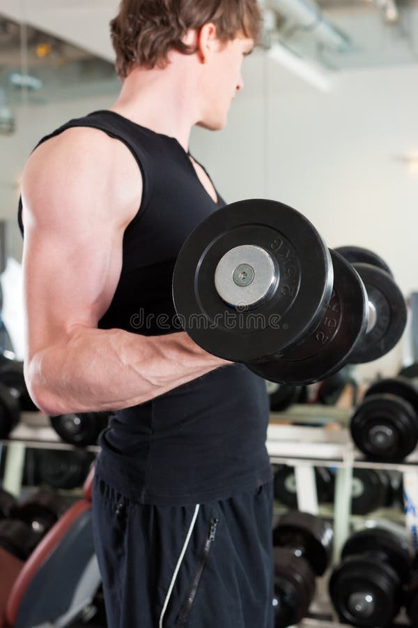 Sport - Man is Exercising with Barbell in Gym Stock Photo - Image of ...