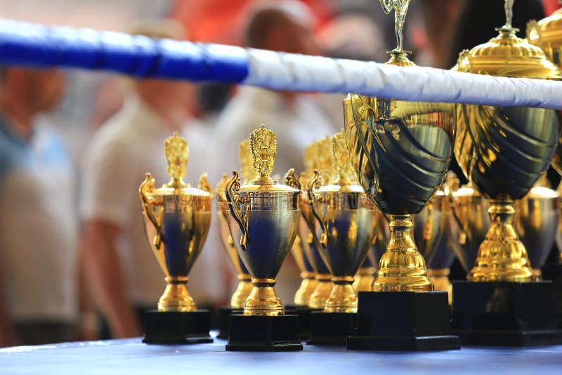 Sport Stack Gold Trophy Cup in the Ring Stock Photo - Image of bottle ...
