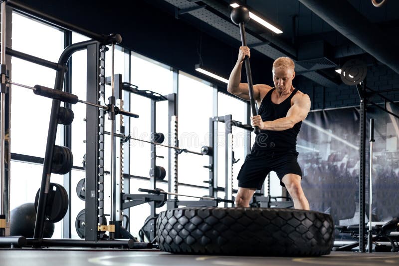 Sport Training for Endurance, Strong Man Hitting Hammer. Concept of ...