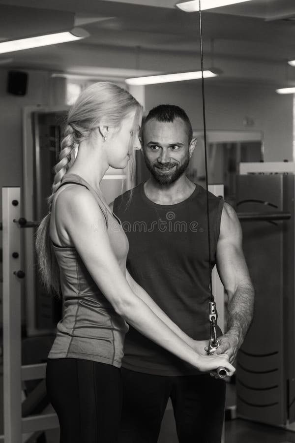 Sporting couple in the gym stock image. Image of muscle - 71933023