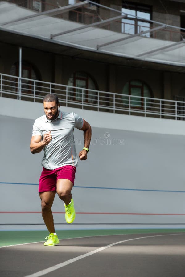 Sportive Energetic African American Young Man Running Outdoors Stock ... Sportive Energetic African American Young Man Running Outdoors Stock ...