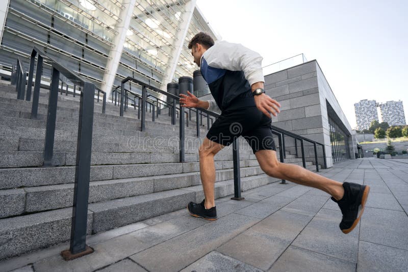 Sportive Man Training Outdoors, Running on Steps Stock Image - Image of ...