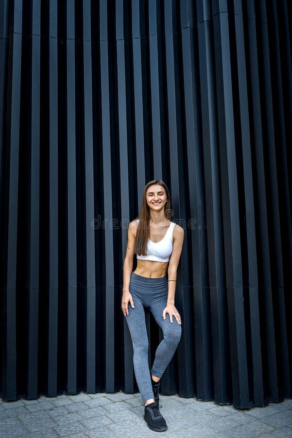 Sportive and Very Slim Woman Posing Outdoors on Abstract Background ...