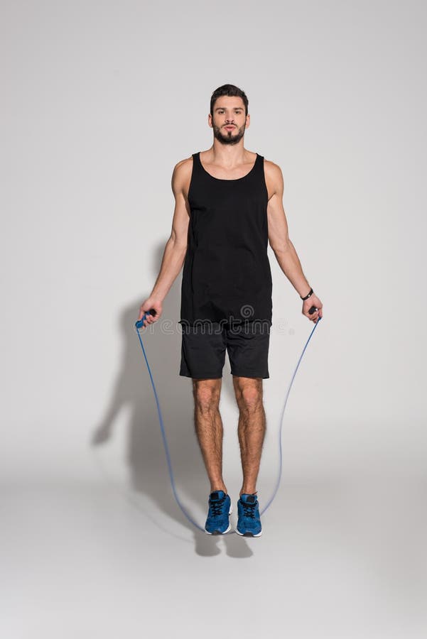 Sportive Young Man Jumping with Rope Stock Photo - Image of training ...