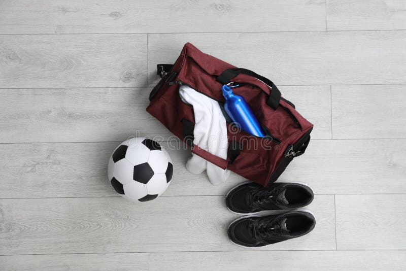 Sports Bag with Training Stuff and Equipment on White Floor, Flat Lay ...