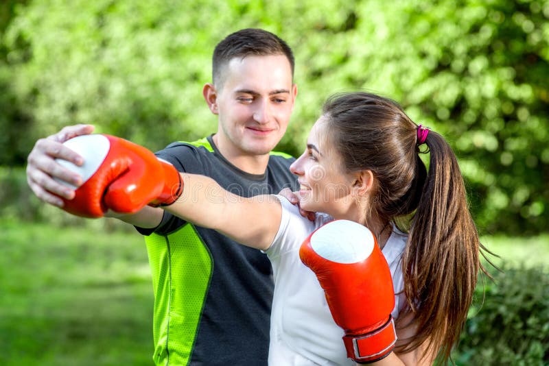 Sports couple in the park stock photo. Image of sparring - 45769768