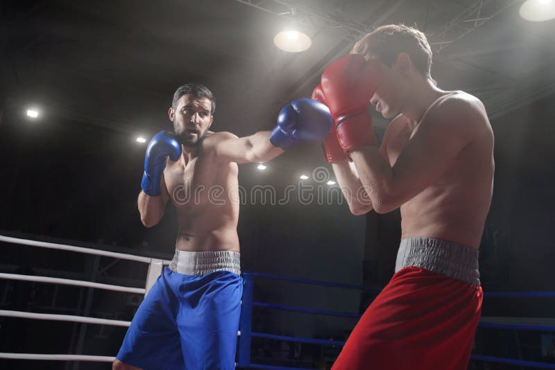 Fighting in boxing ring stock image. Image of people - 80672869