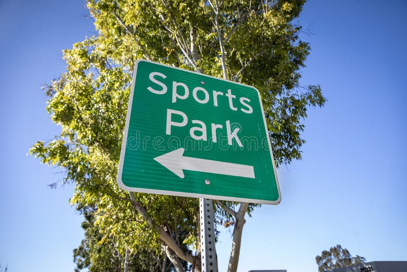 Sports Park Sign in Green with Arrow Pointing Camera Left with Green ...