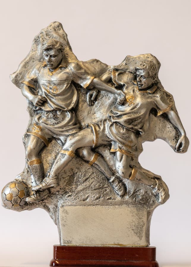 Sports Trophy Stands in Front of a White Wall Stock Photo - Image of ...