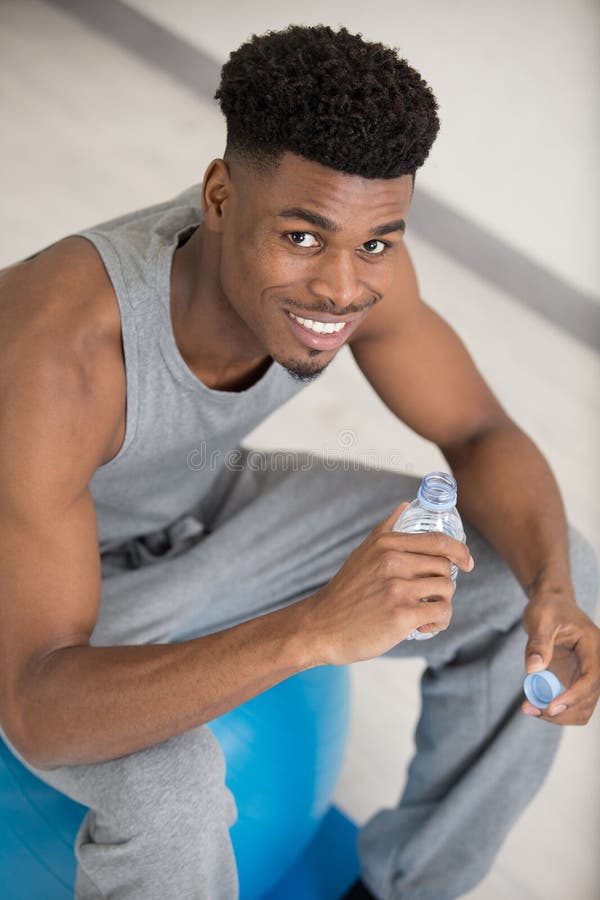 Sportsman Drinking Water Sat on Aerobic Ball Stock Photo - Image of ...