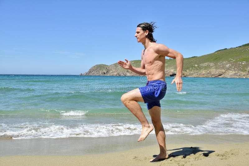 Sportsman Running on the Beach Stock Photo - Image of coast, handsome ...