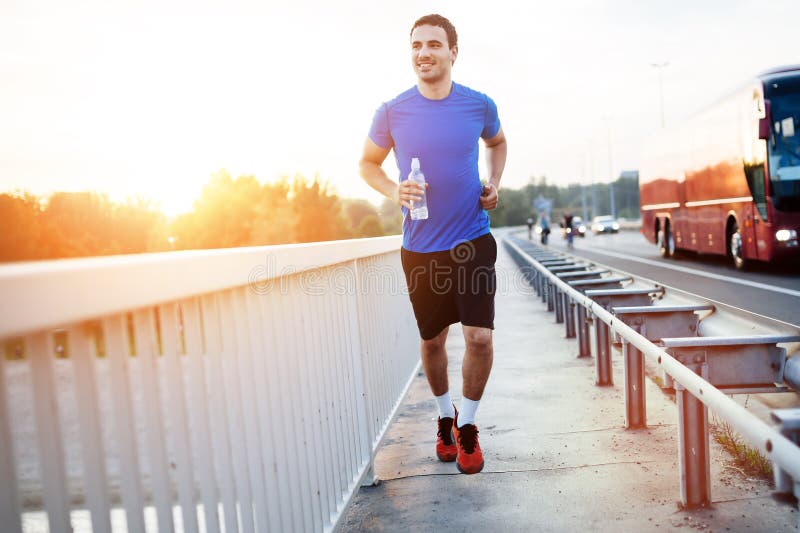 Sportsman Running Over Bridge Stock Photo - Image of active, outdoors ...