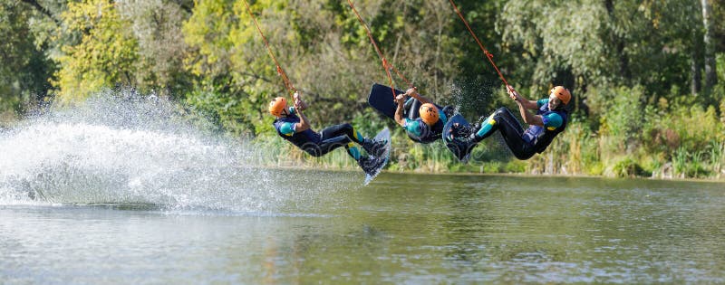 Sportsman on Wakeboard Performing Back Roll Inversion on the River ...
