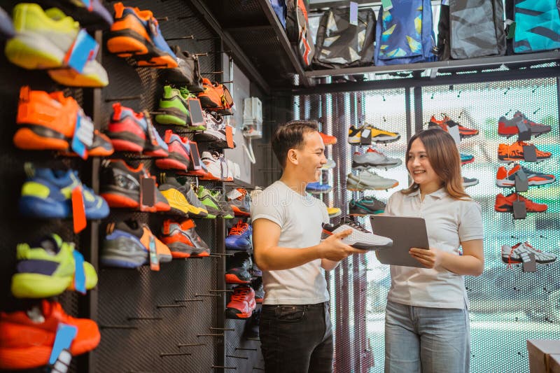 Sportswear Store Workers Checking Shoe Product Stock Photo - Image of ...