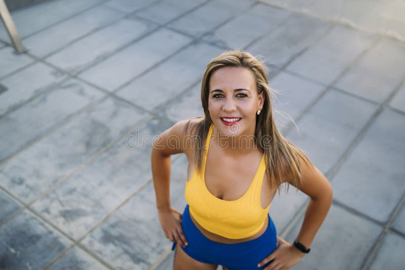 Sportswoman Posing with Hands on Hips after Training Outdoors Stock ...