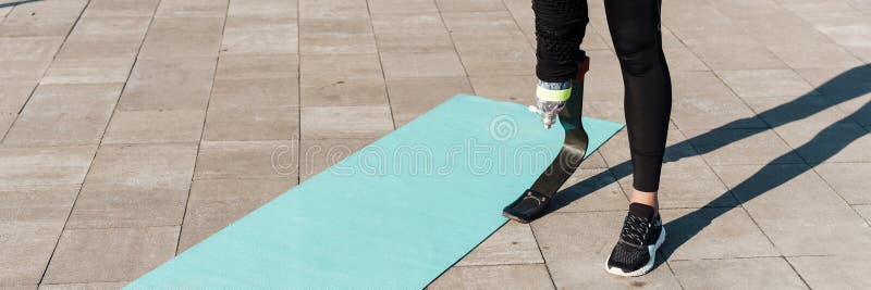 Sportswoman with Prosthesis Doing Exercise Working Out Outdoors Stock ...
