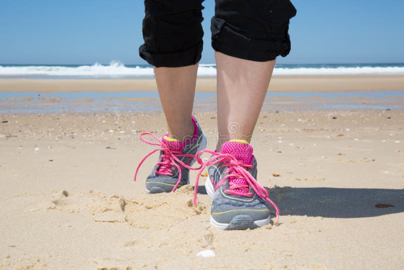 Sportswoman Runner Getting Ready Running Shoes on Beach. Stock Image ...