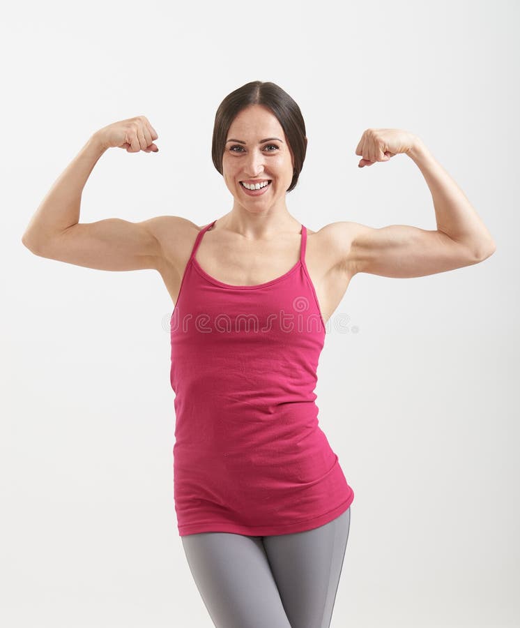 Sportswoman Showing Two Biceps Stock Photo - Image of biceps, woman ...