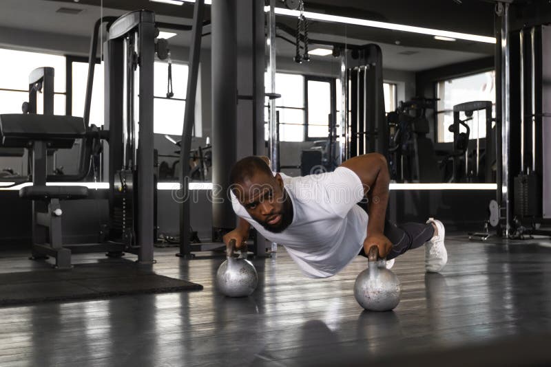 Sporty African Man Doing Push-up in a Gym. Stock Image - Image of ...