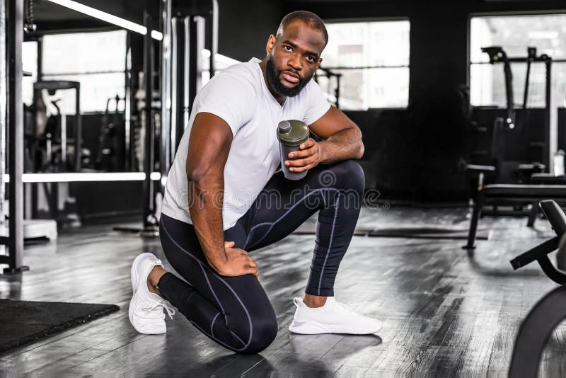 Sporty African Man Resting, Having Break Drinking Water after Doing ...
