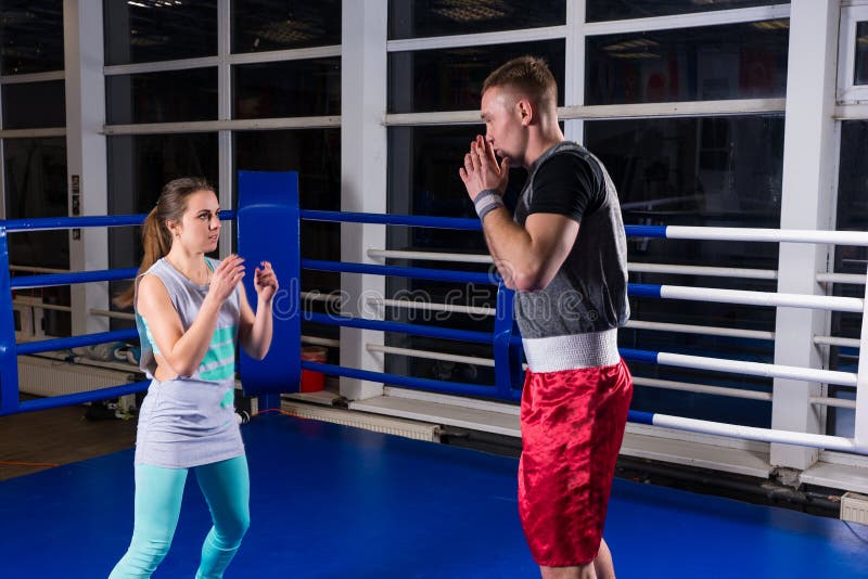 Sporty Couple Practicing Boxing in a Boxing Ring Stock Photo - Image of ...