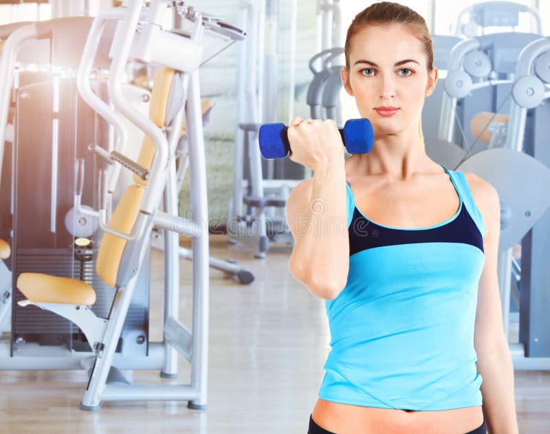 Sporty Female Doing Physical Exercise in Gym Stock Photo - Image of ...