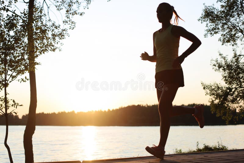 Sporty Female Jogger Running and Training Outside in Nature Stock Image ...