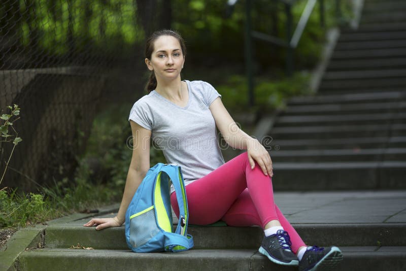 Sporty Girl Sitting on the Steps Outdoors. Stock Image - Image of lady ...