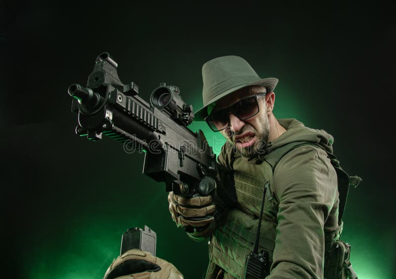 A Sporty Guy Poses with an Automatic Rifle Stock Image - Image of ...