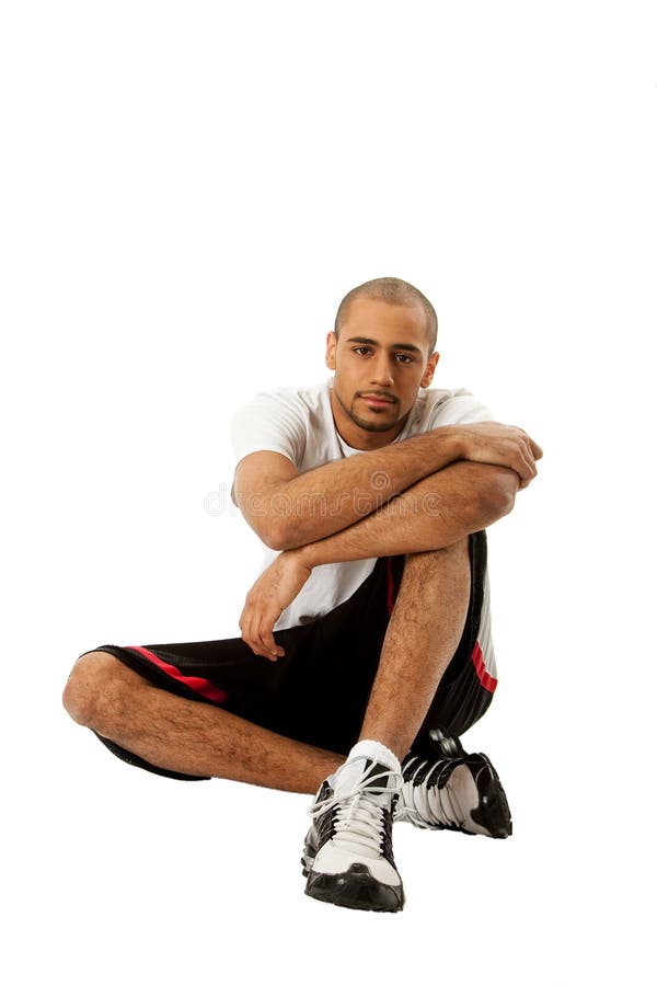 Sporty guy sitting stock image. Image of sneaker, handsome - 8670337