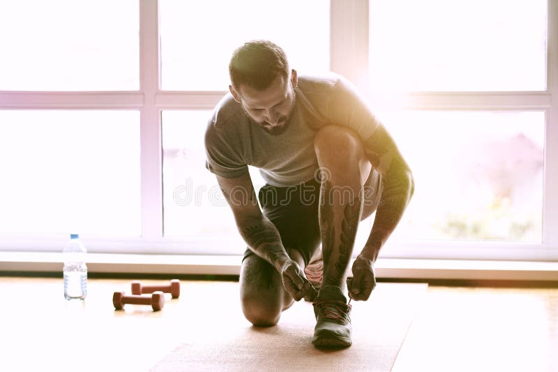 Sporty Man Getting Ready for Training Tying Shoes Laces Stock Photo ...