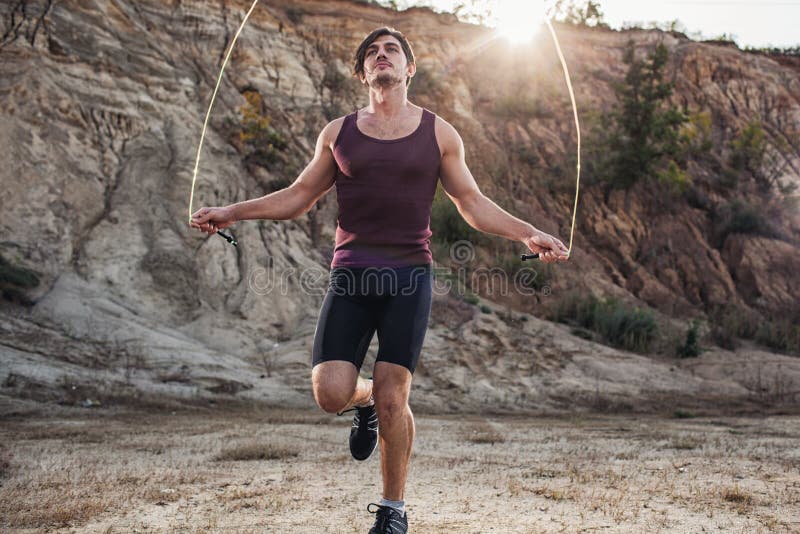 Sporty Man Jumping Rope Outdoors Stock Image - Image of shore, fitness ...