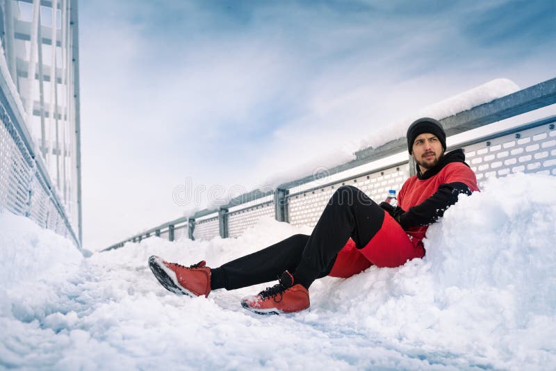 Sporty man relax in snow stock photo. Image of lifestyle - 165572022