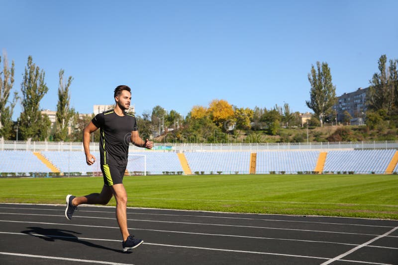 Sporty Man Running at Stadium Stock Photo - Image of speed, fast: 131352444