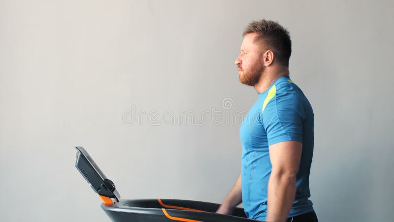 Sporty Man Walking on Treadmill at the Gym Stock Footage - Video of ...